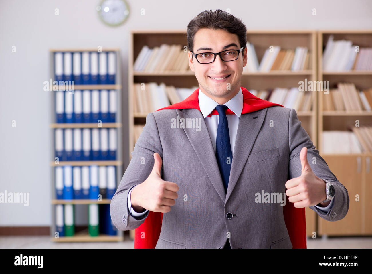Superhero businessman working in the office Stock Photo - Alamy
