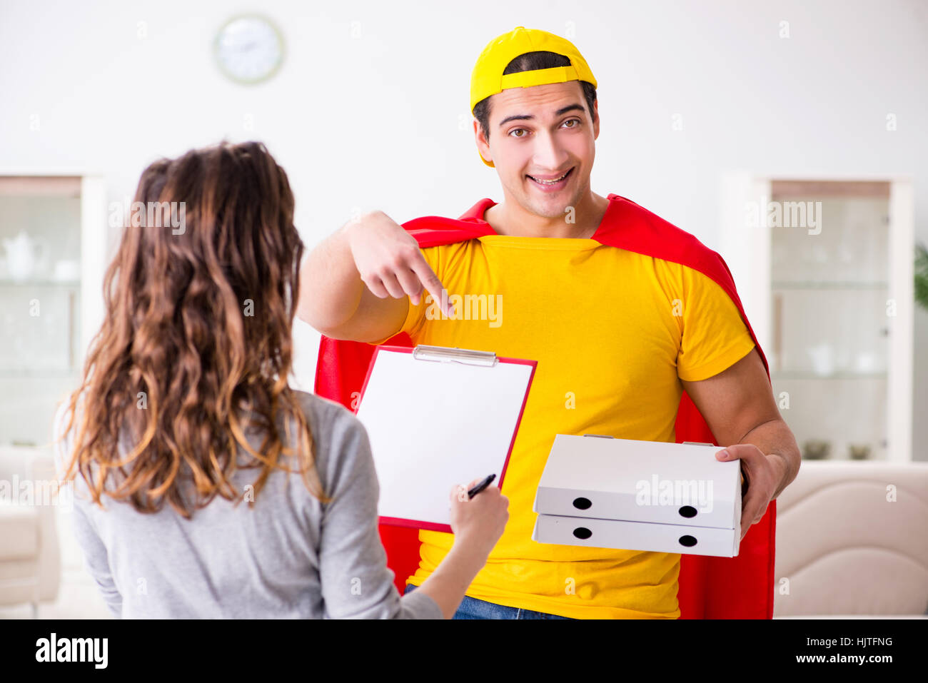 Superhero pizza delivery guy with red cover Stock Photo - Alamy