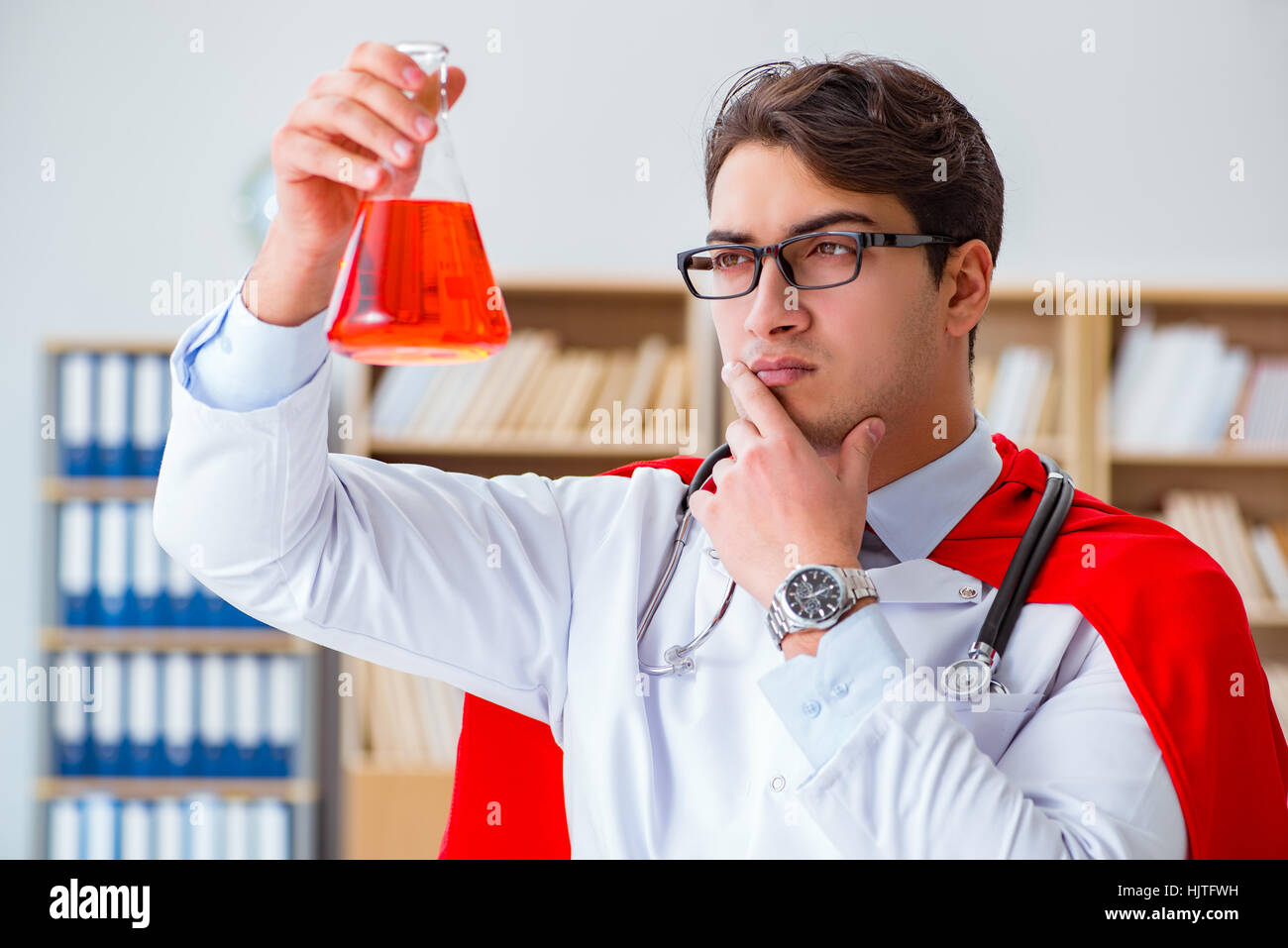 Superhero doctor working in the hospital lab Stock Photo - Alamy