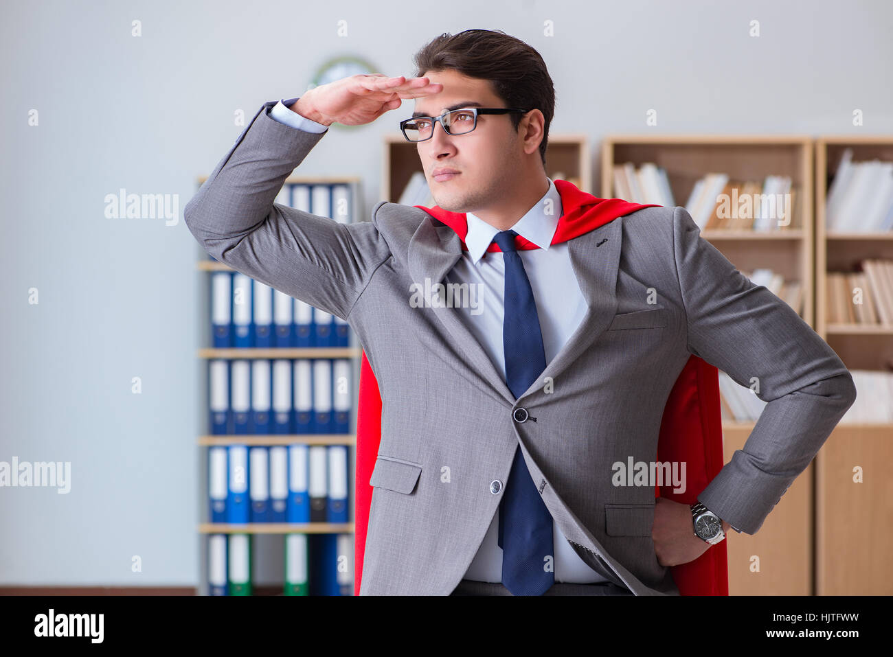 Superhero businessman working in the office Stock Photo - Alamy