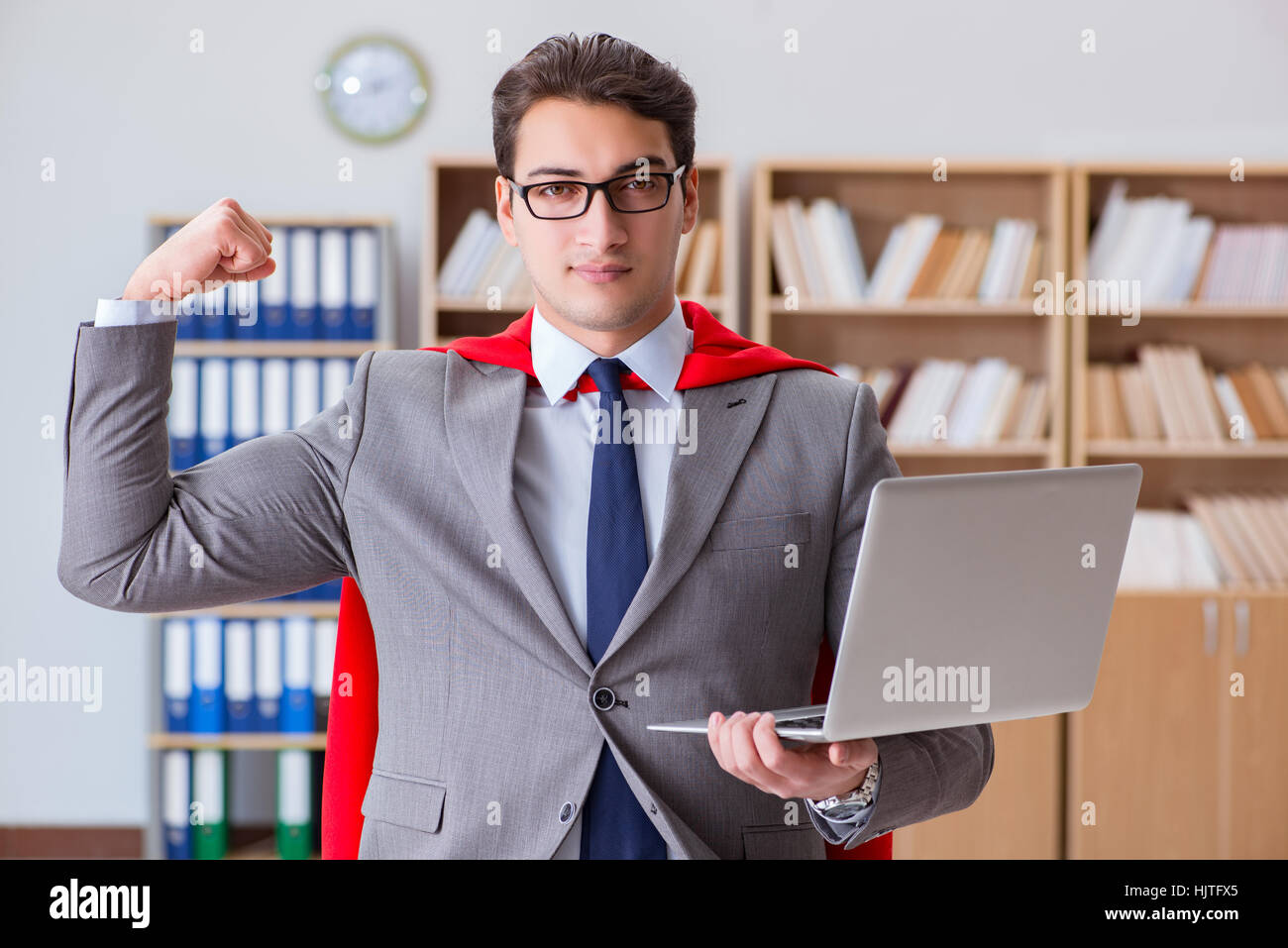 Superhero businessman working in the office Stock Photo - Alamy