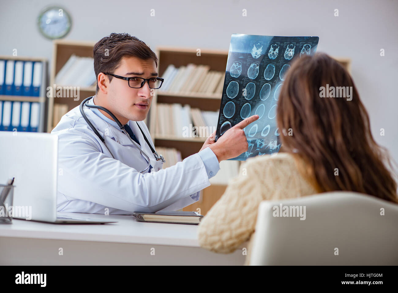 Young doctor looking at computer tomography x-ray image Stock Photo - Alamy