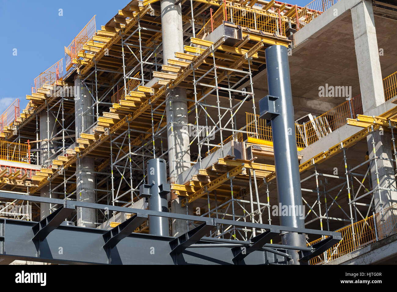 building under construction with scaffolding and crane Stock Photo - Alamy