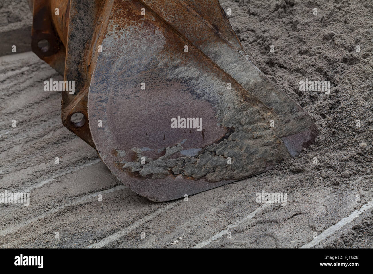 loading sand with bucket on the excavator, note shallow depth of field ...