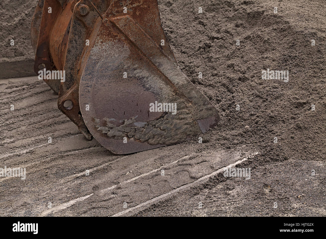 loading sand with bucket on the excavator, note shallow depth of field ...
