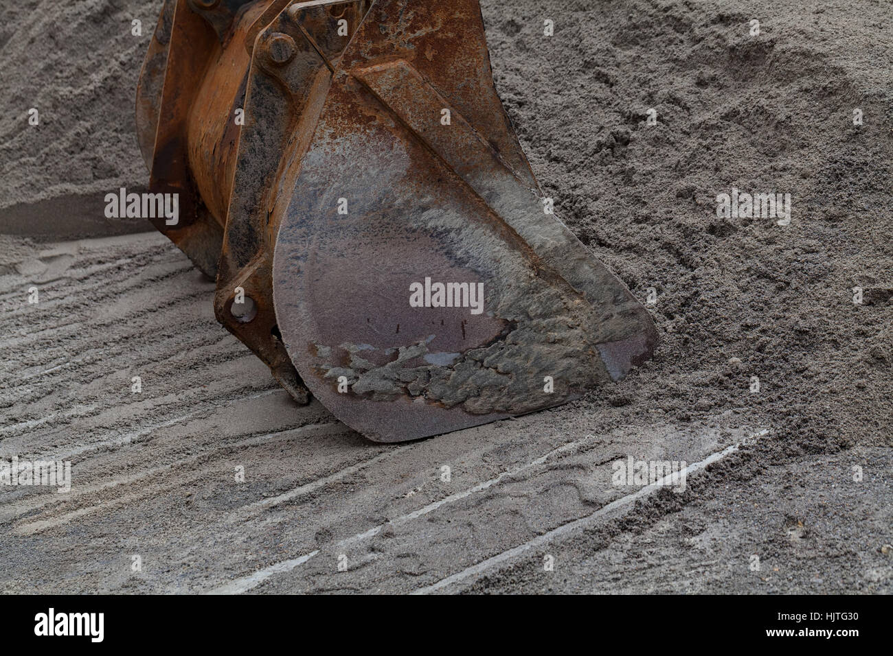 loading sand with bucket on the excavator, note shallow depth of field ...