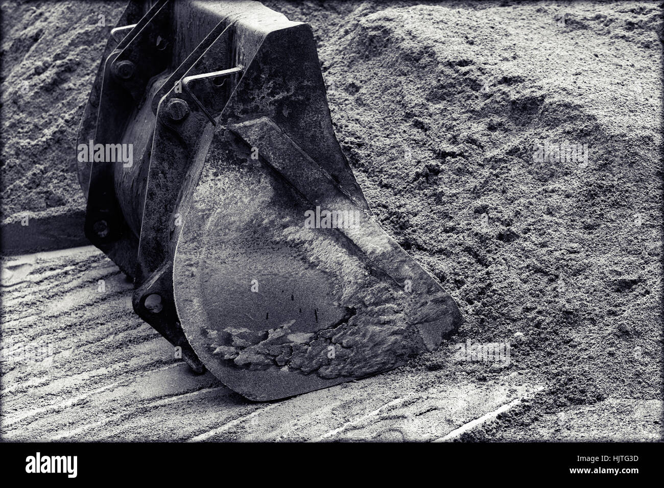 loading sand with bucket on the excavator, note shallow depth of field ...