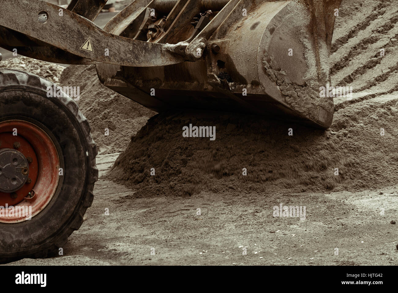 loading sand with bucket on the excavator, note shallow depth of field ...