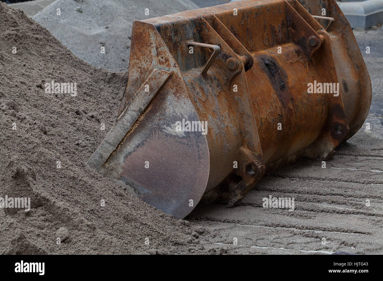 loading sand with bucket on the excavator, note shallow depth of field ...