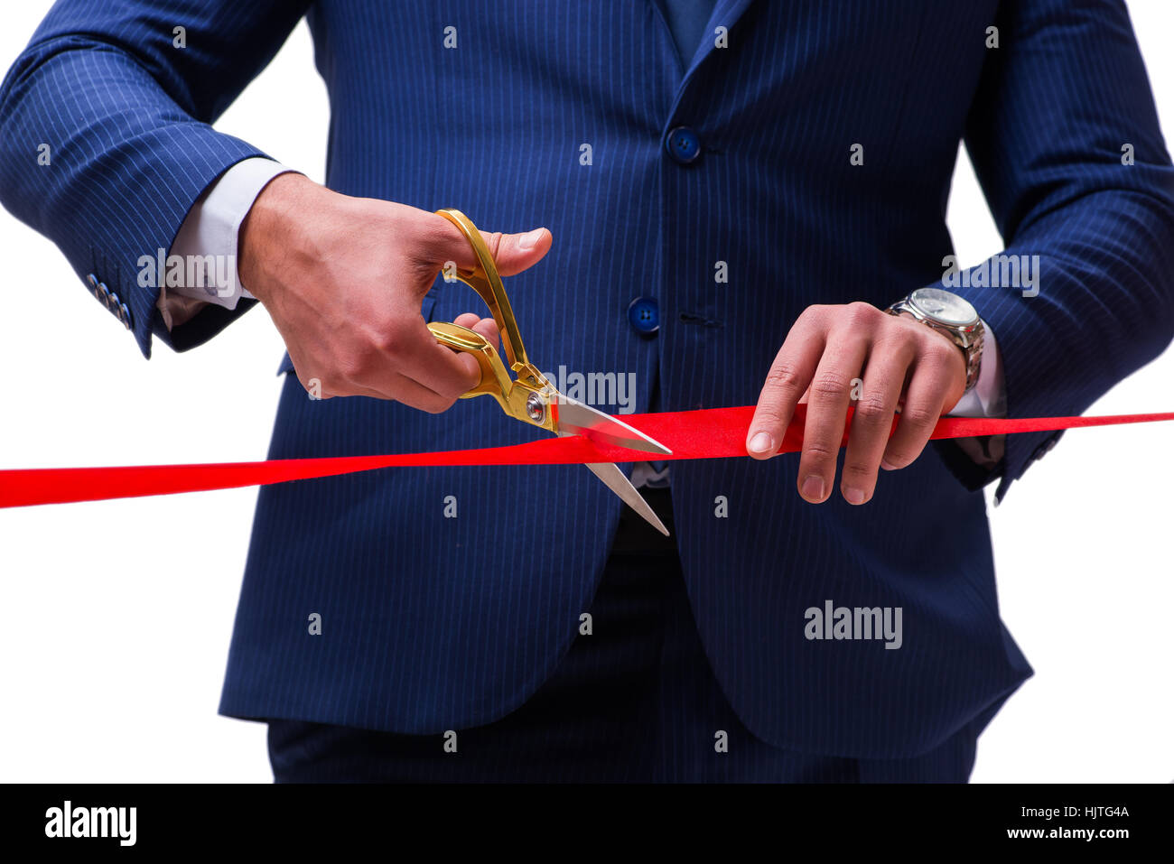 Businessman cutting red ribbon isolated on white Stock Photo - Alamy