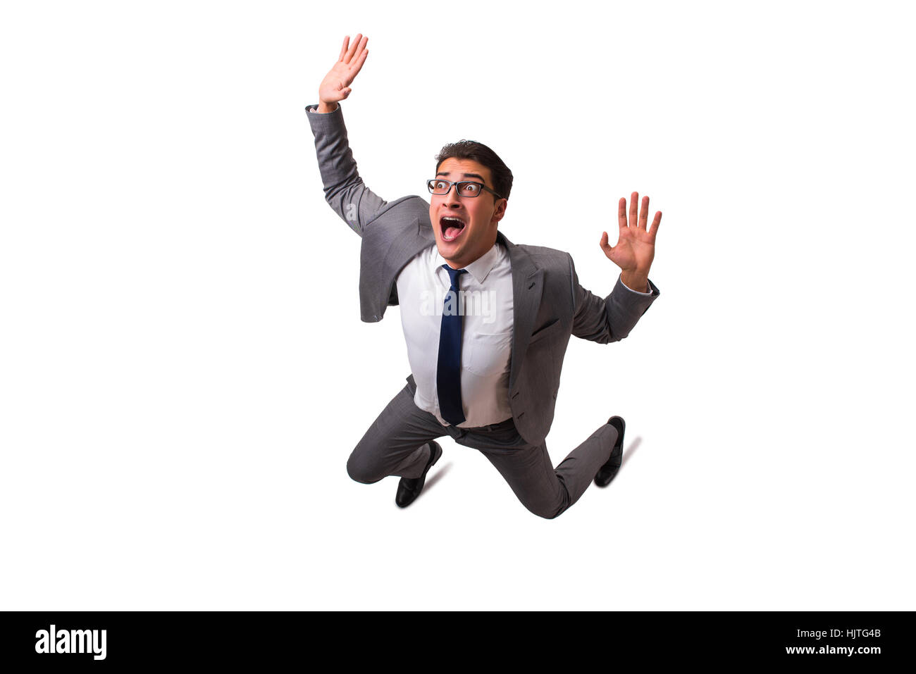 Falling businessman isolated on the white background Stock Photo - Alamy