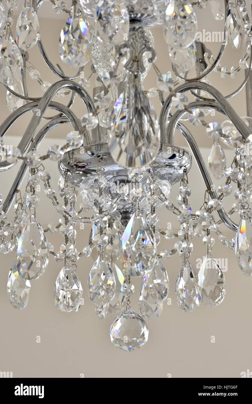Crystal chandelier hanging from the ceiling of a master bedroom Stock ...