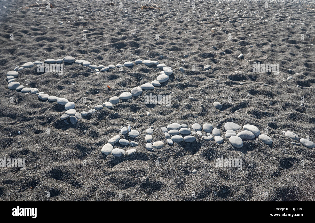 Love heart design in pebbles on beach Stock Photo - Alamy
