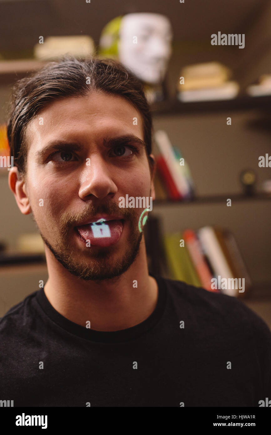 Man with a lock on his tongue Stock Photo - Alamy