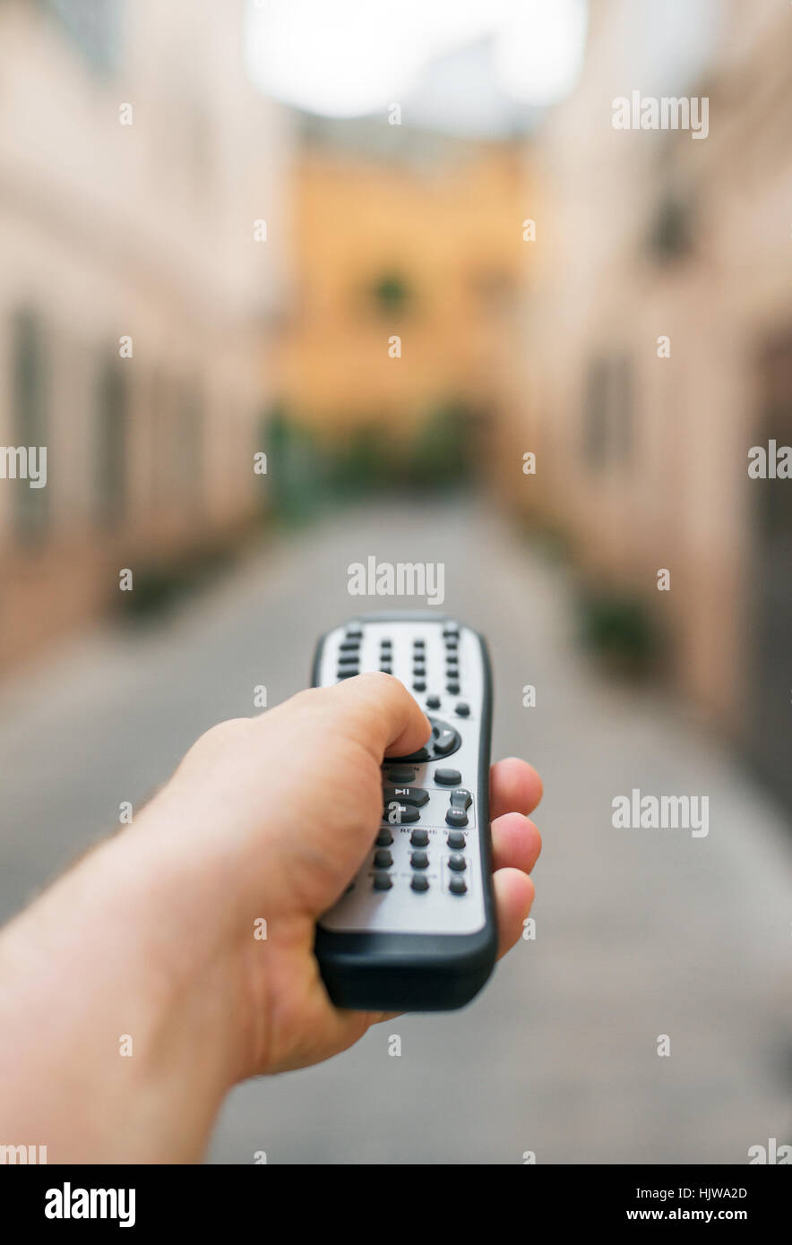 Summer vacation concept. Man holding remote control Stock Photo - Alamy
