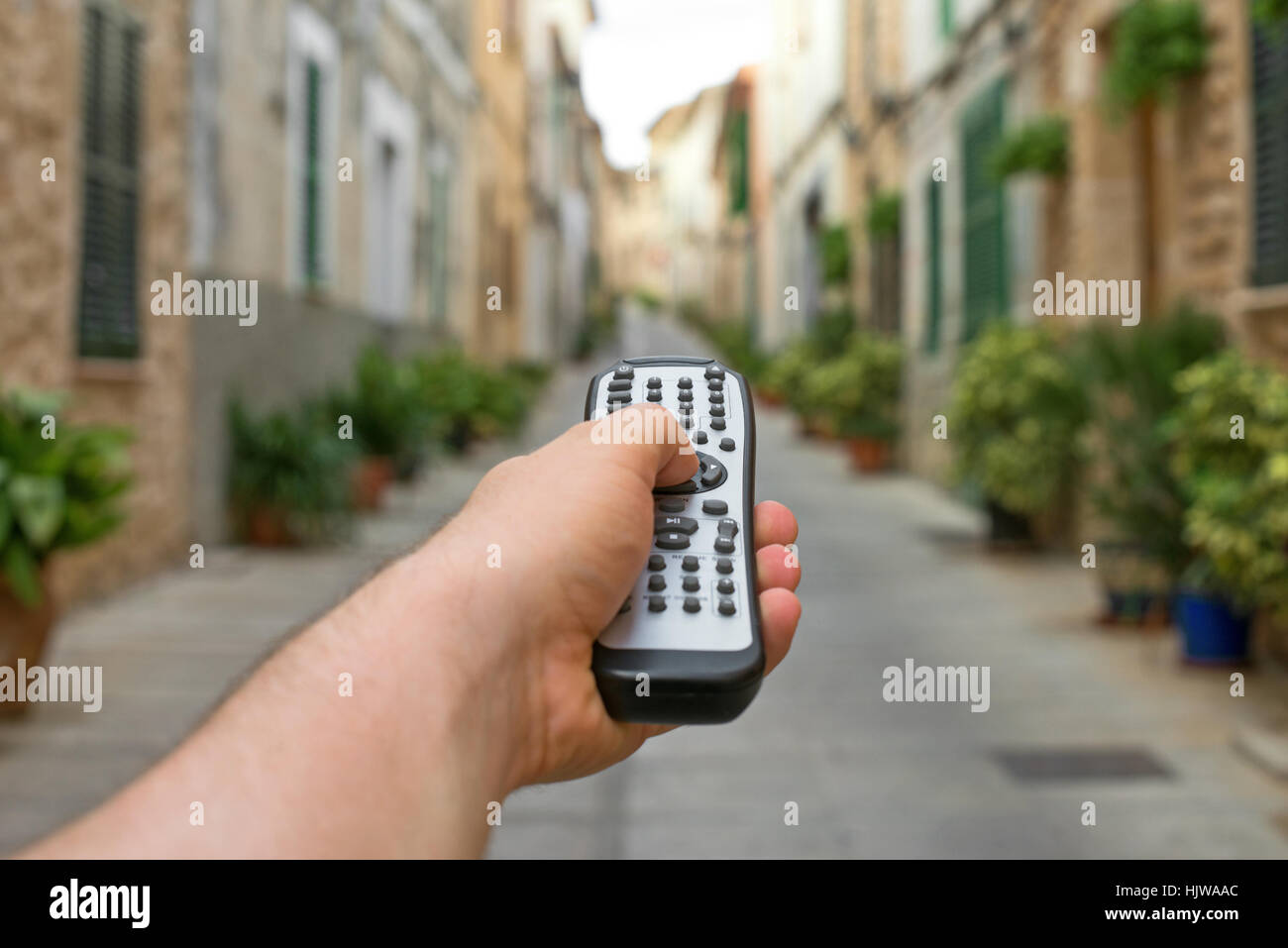 Summer vacation concept. Man holding remote control Stock Photo - Alamy
