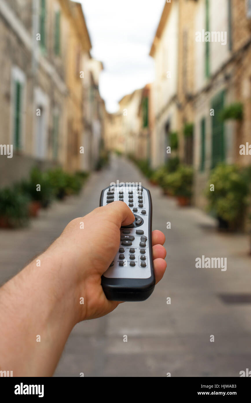 Summer vacation concept. Man holding remote control Stock Photo - Alamy