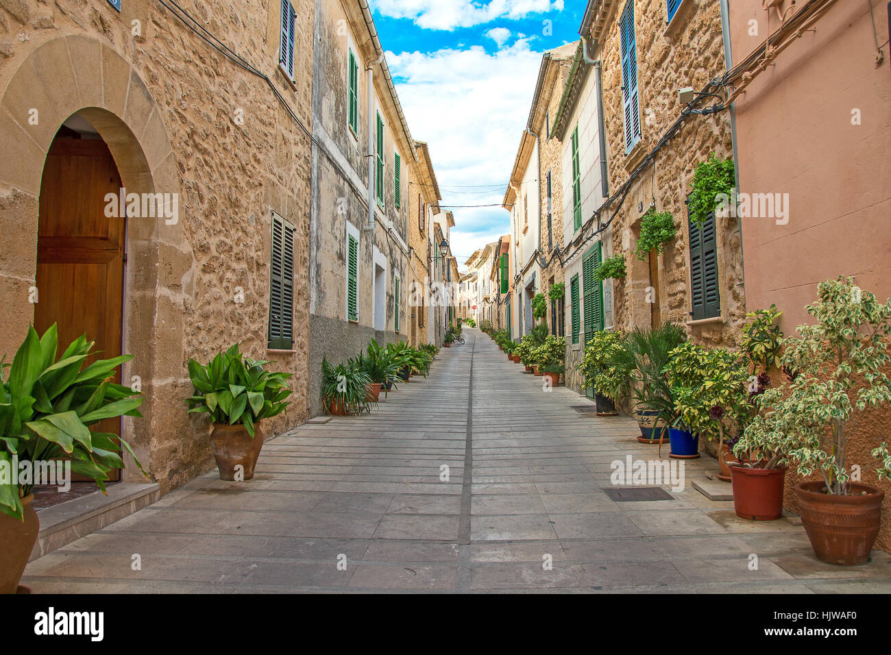 Beautiful narrow old street in mediterranean city Stock Photo - Alamy
