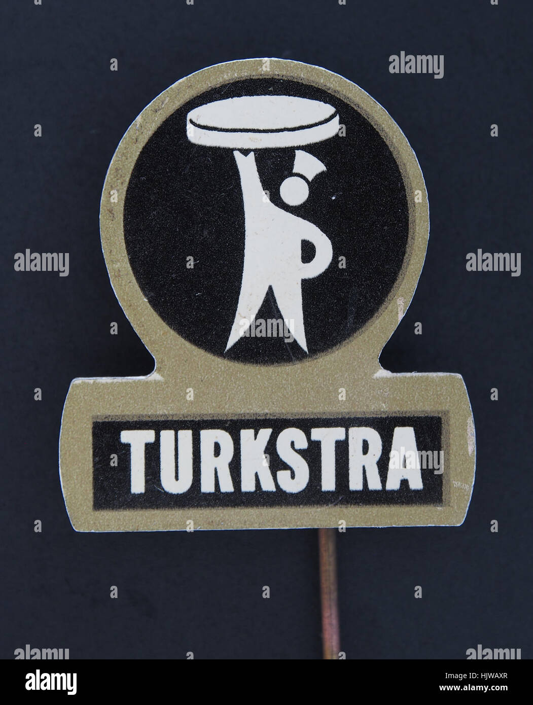 A promotional advertising pin from Turkstra, used in marketing ...