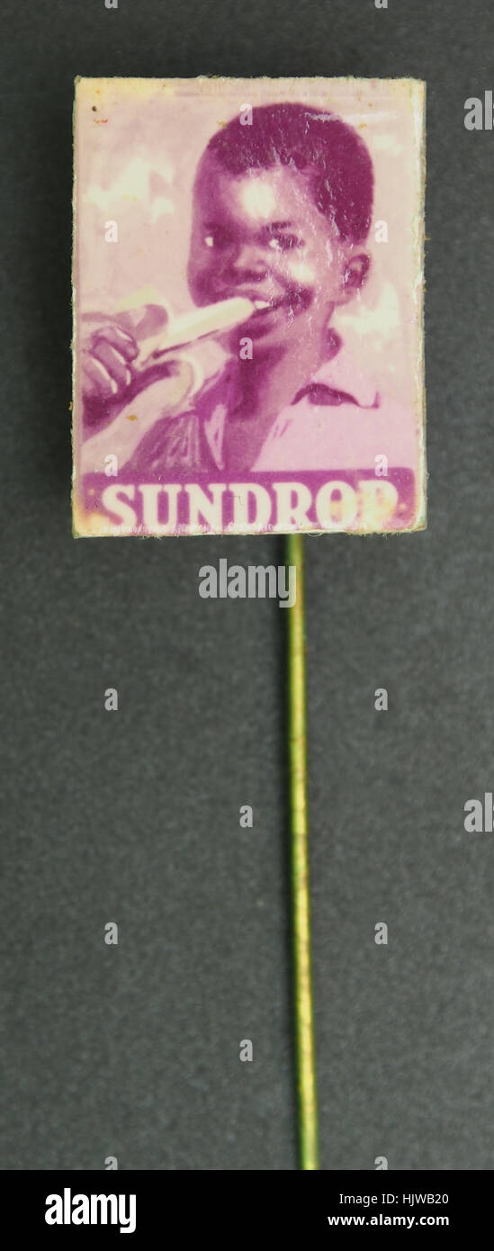 The Sundrop advertising pin features an image of a boy eating a banana ...