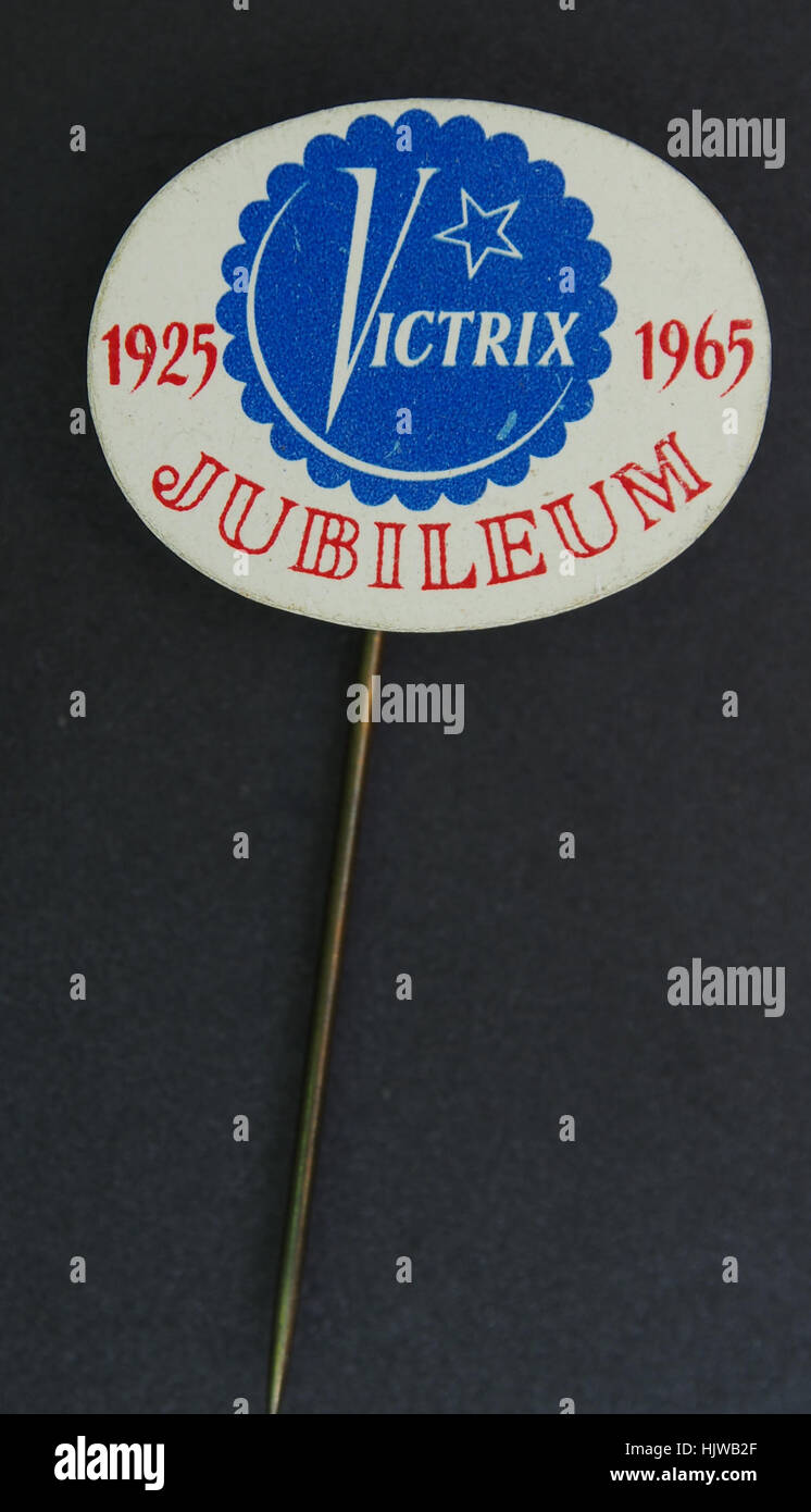 A pin commemorating a milestone or anniversary for the Victrix brand Stock Photo - Alamy