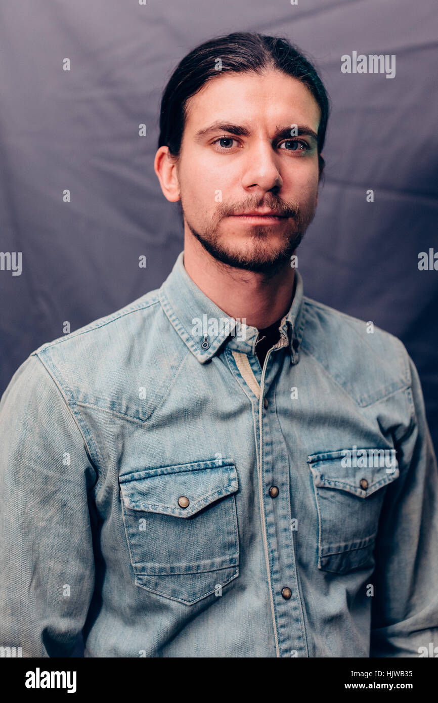 Man in denim jacket Stock Photo - Alamy