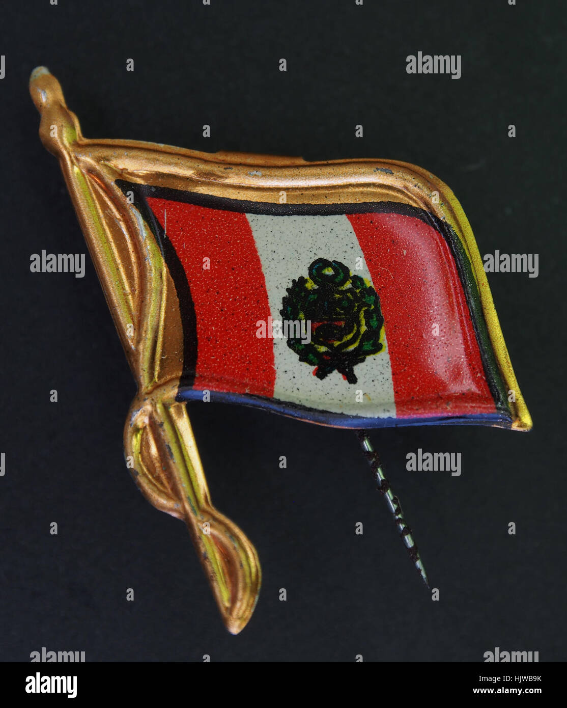A vintage advertising pin featuring the flag of Peru, promoting ...