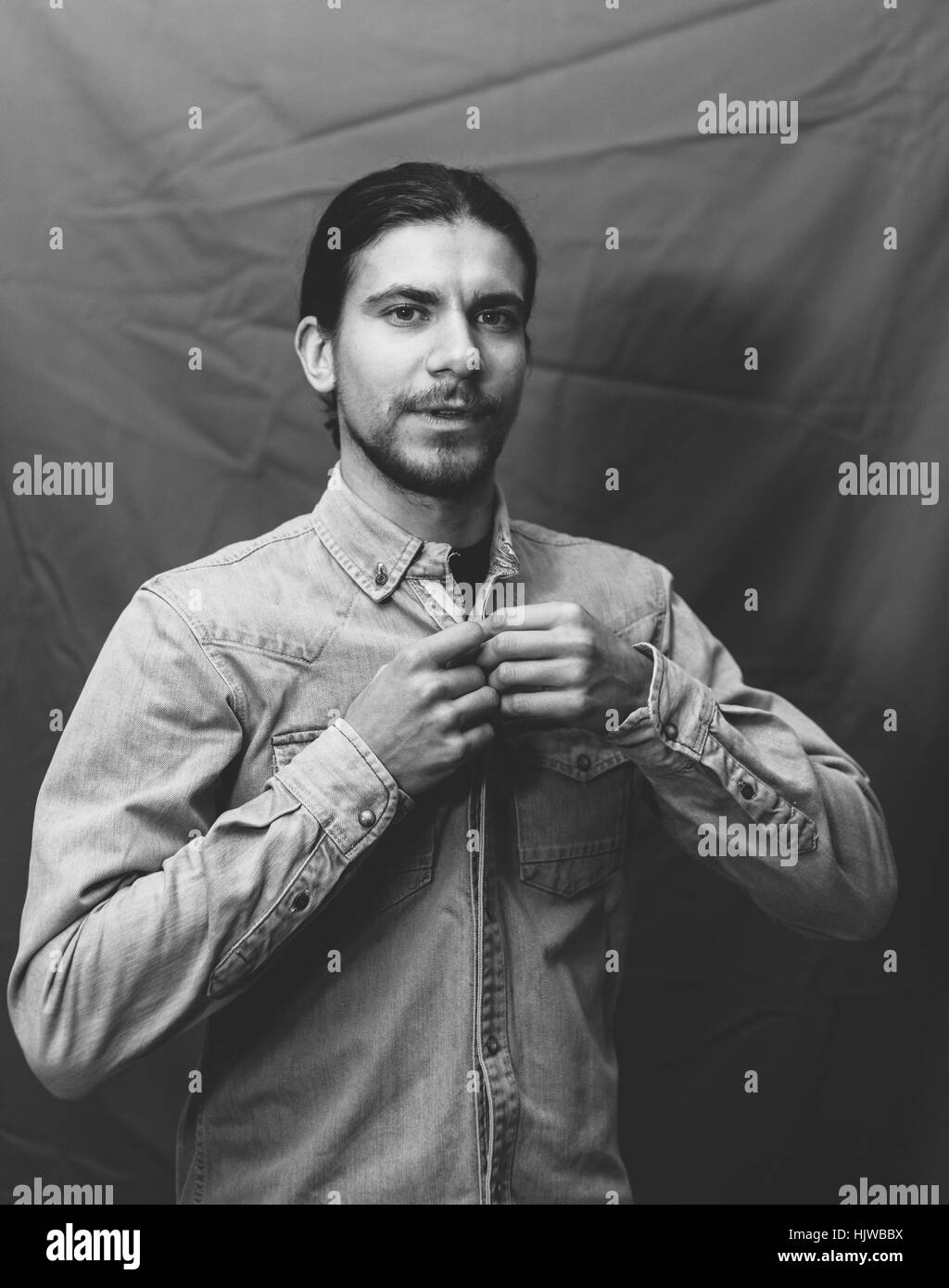 Portrait of a Man in denim jacket Stock Photo - Alamy