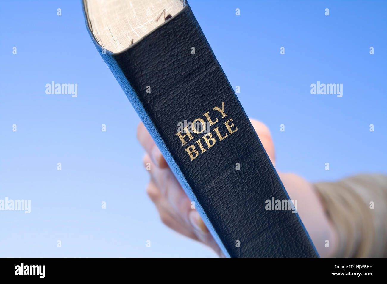 Hand holding bible hi-res stock photography and images - Alamy