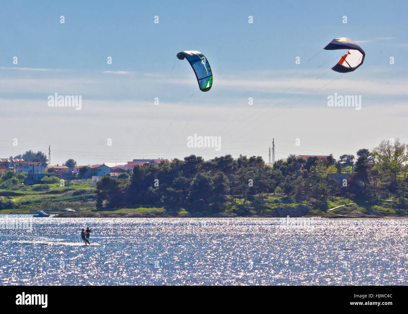 Pair of kitesurfers kitesurfing on the sea Stock Photo - Alamy