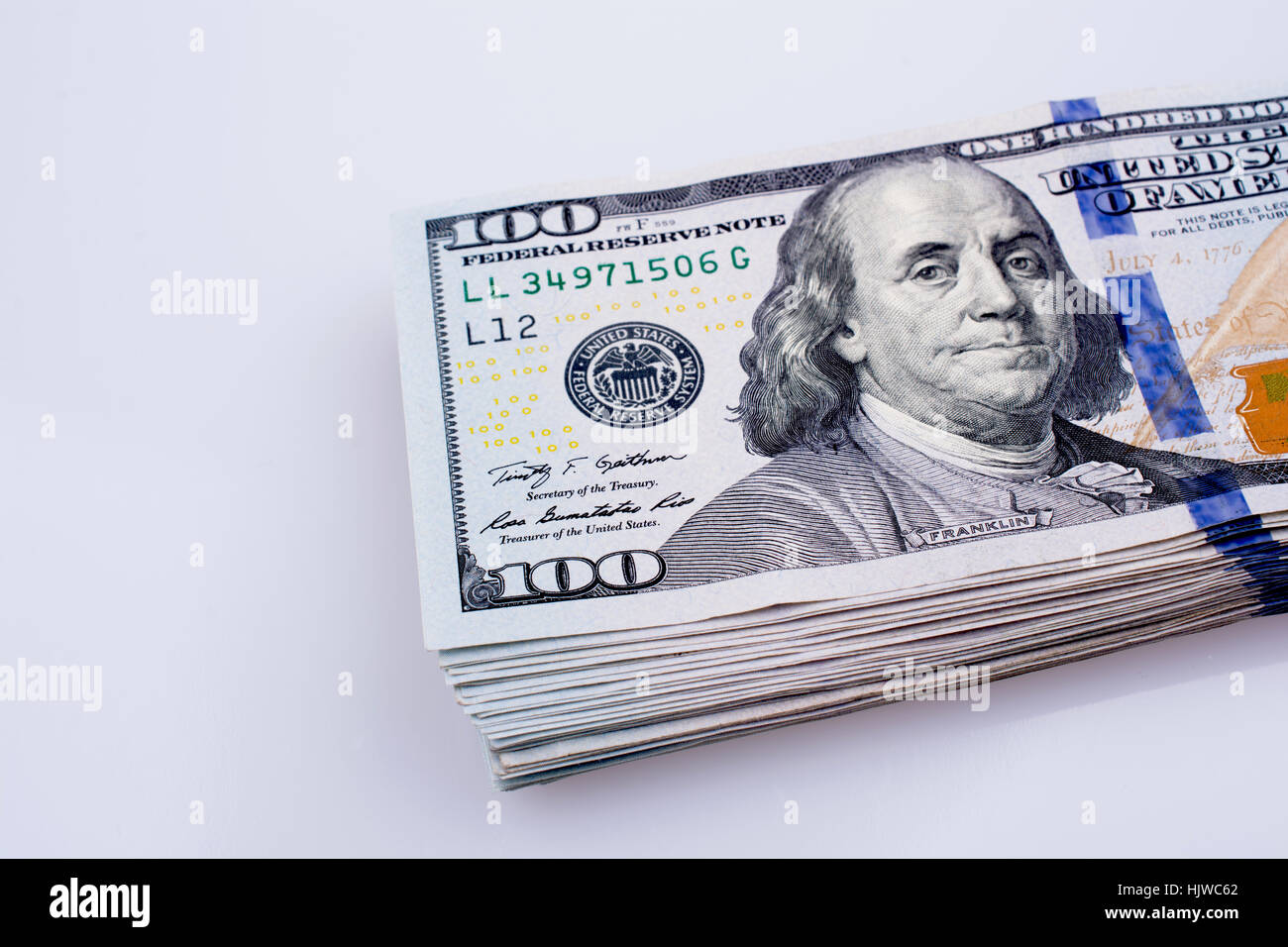American 100 dollar banknotes made of paper placed on white background ...