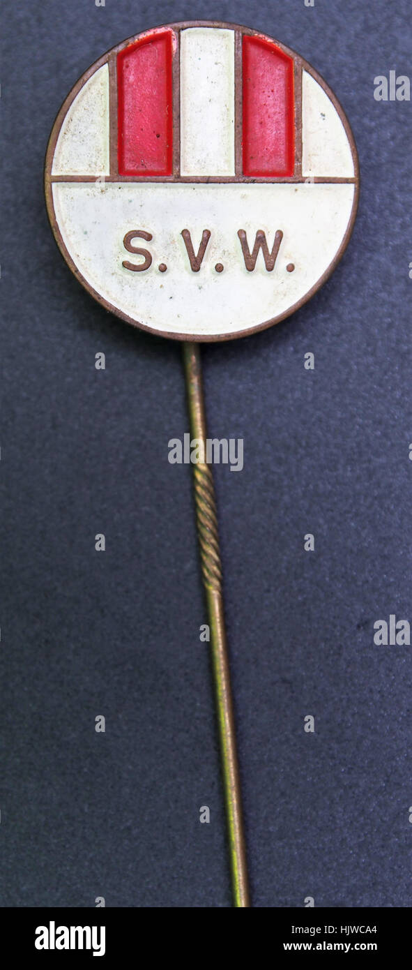 SVW is a vintage advertising pin, representing a brand or company from ...