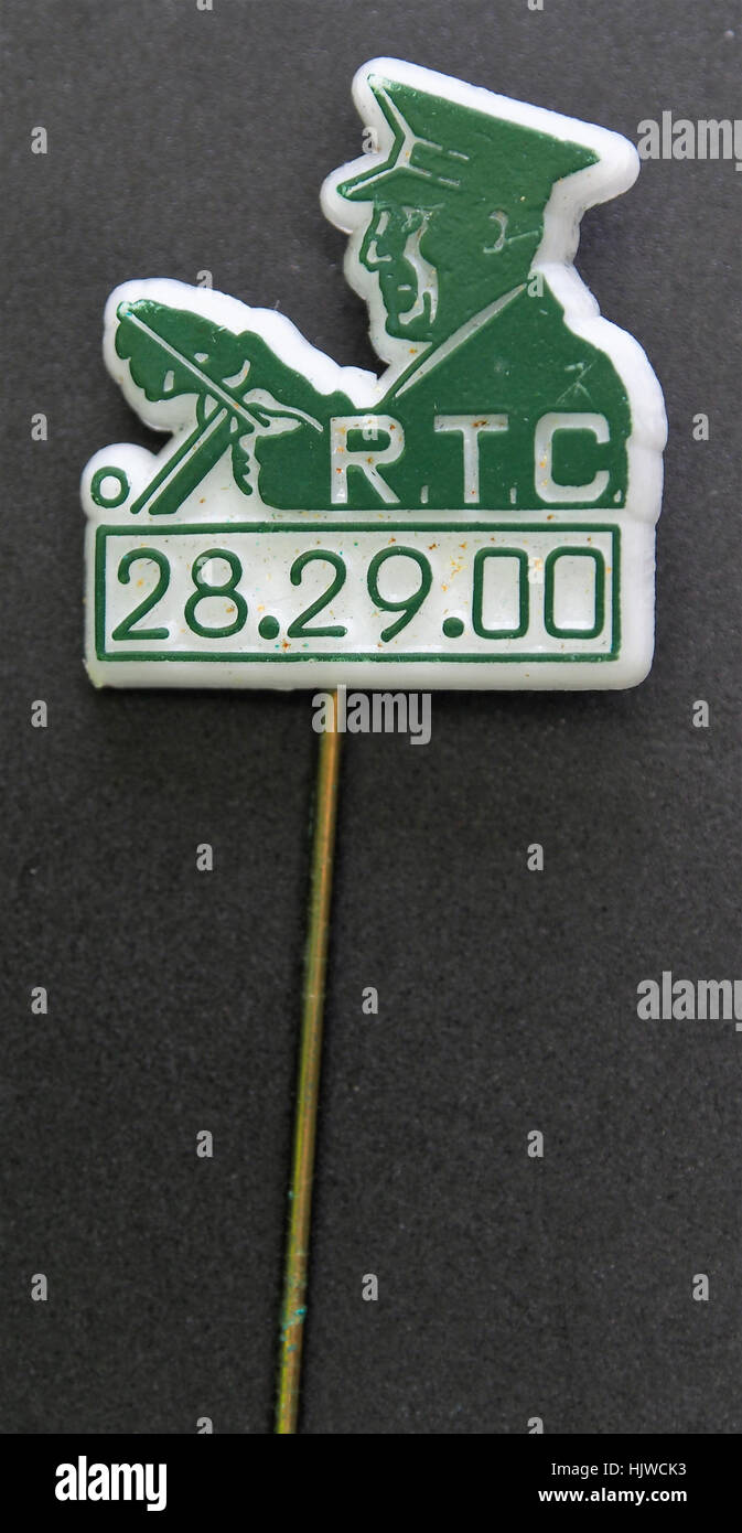 A vintage advertising pin for RTC, which could represent a company or ...