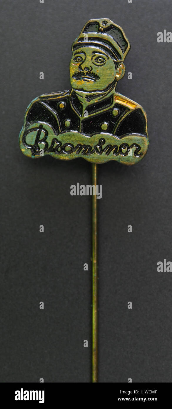 A black Bromsnor advertising pin, a rare vintage piece representing a ...