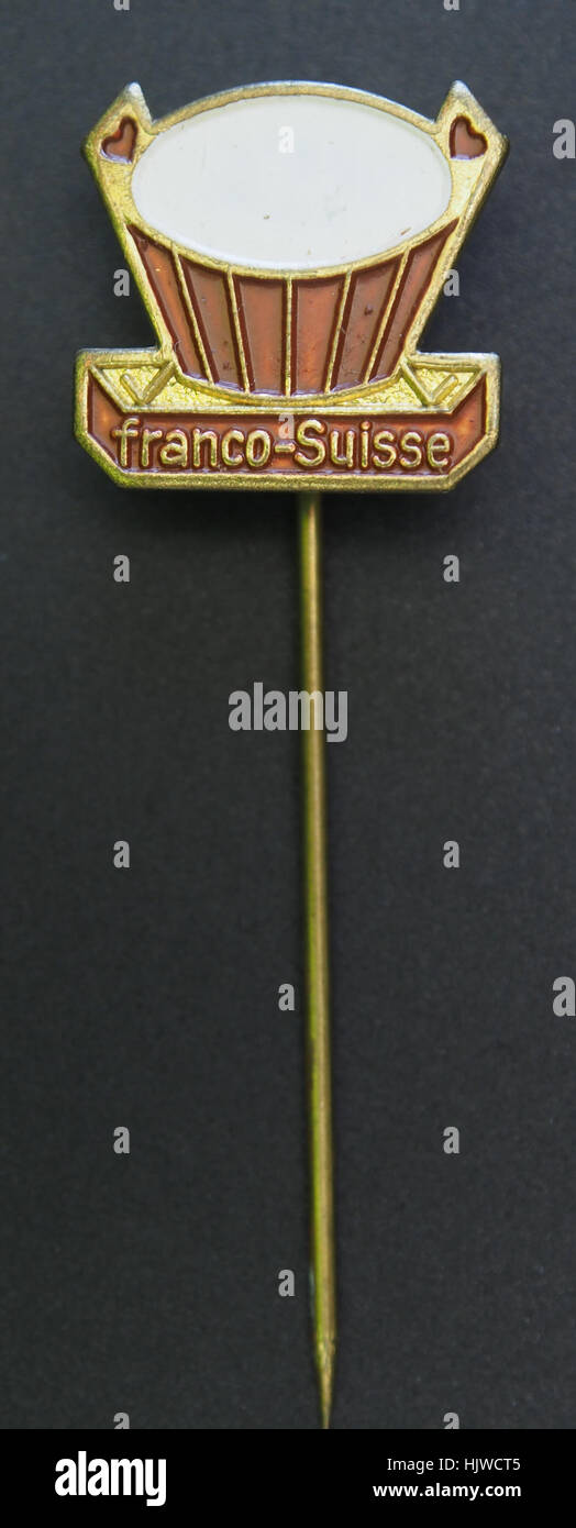 The Franco-Suisse speldje12 is a vintage advertising pin from the ...
