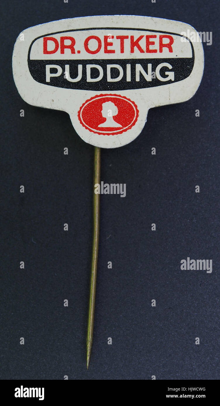 This advertising pin promotes Dr. Oetker's pudding products, a popular ...
