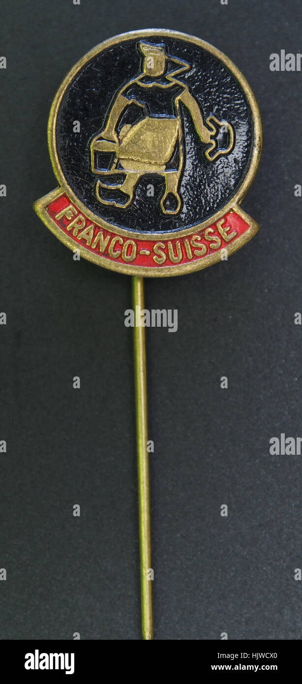 A vintage advertising pin from Franco-Suisse, a Swiss brand known for ...