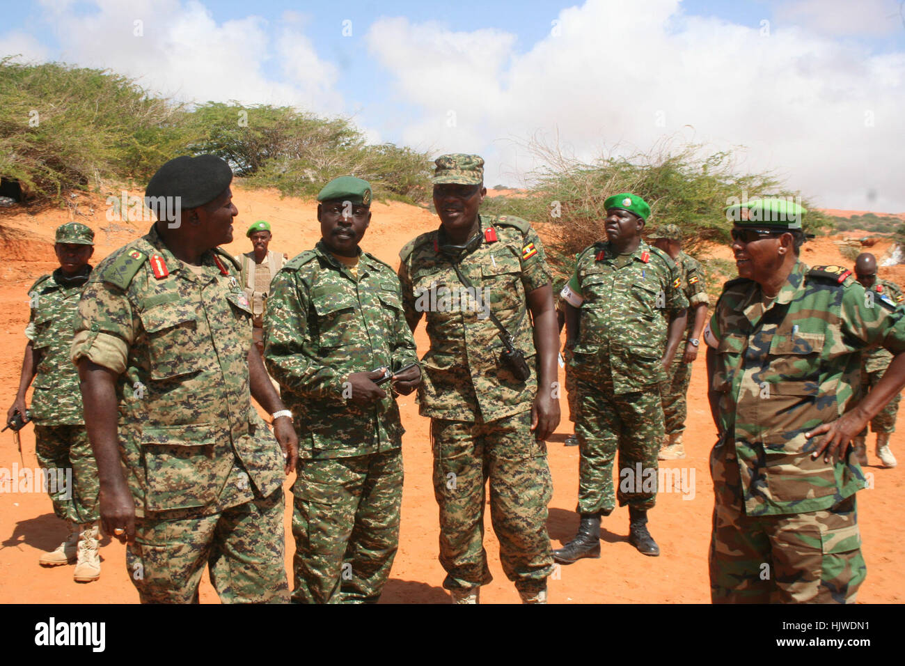 The Ugandan Chief of Defence Forces, Gen. Katumba Wamala (left) talks ...