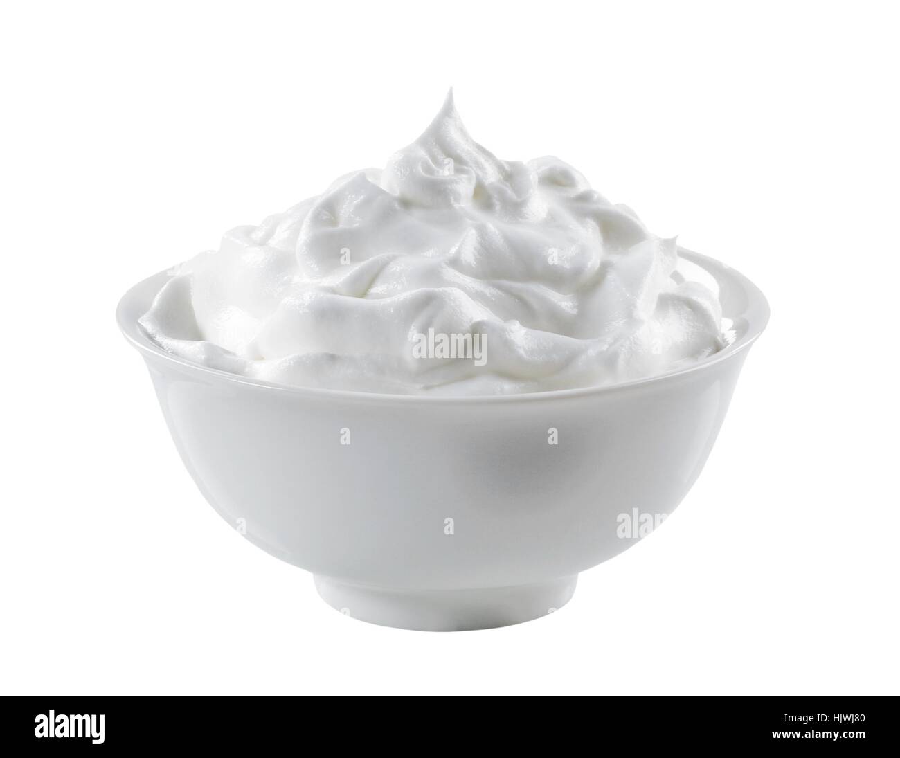 Bowl of cream isolated on white Stock Photo - Alamy