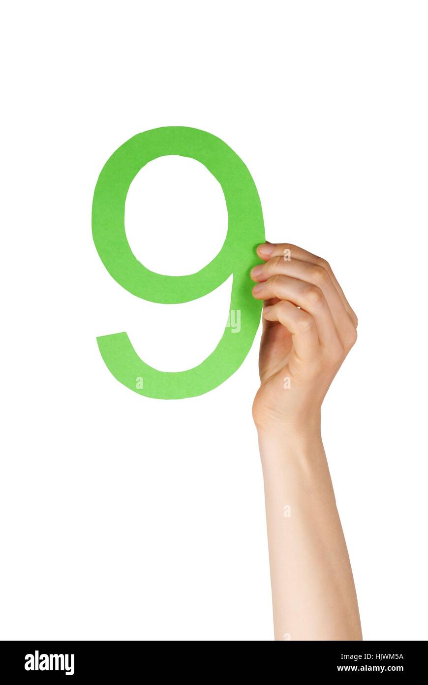 hand holdin up a green number nine, isolated Stock Photo - Alamy