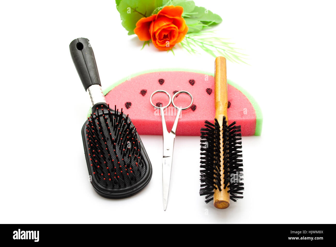 hairbrush with hair scissors and bath sponge Stock Photo - Alamy