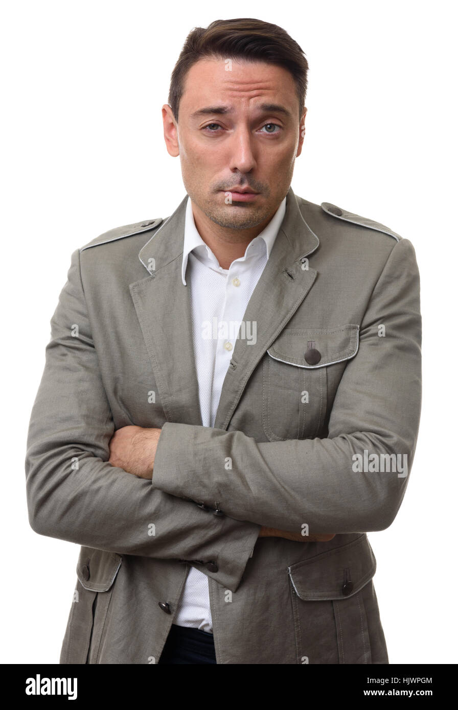 pensive casual man squinting and looking at camera isolated on white ...
