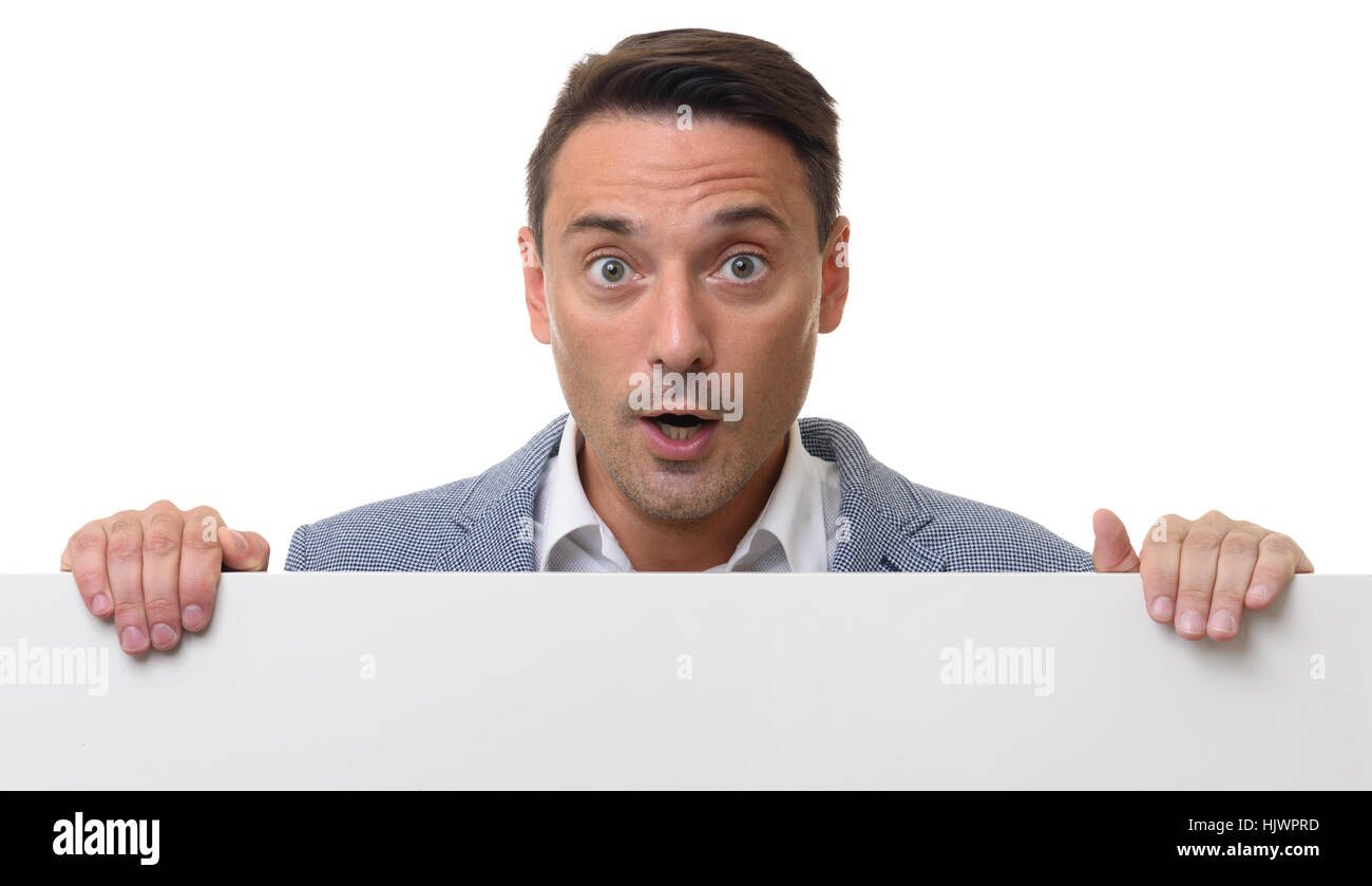 shocked guy holding a blank billboard isolated on white background ...