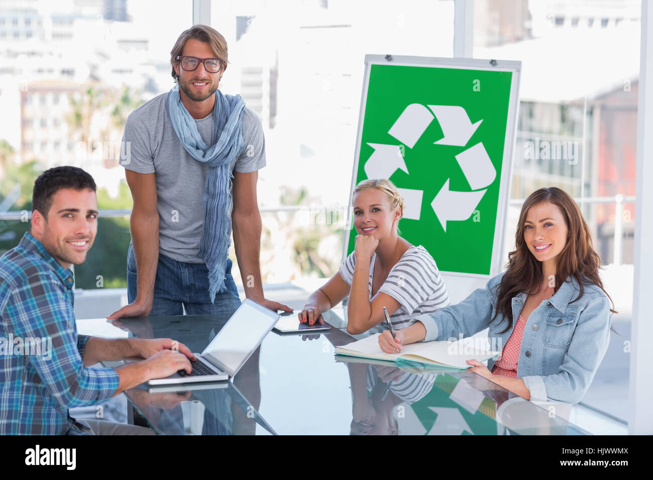 Colleagues recycling in office hi-res stock photography and images - Alamy