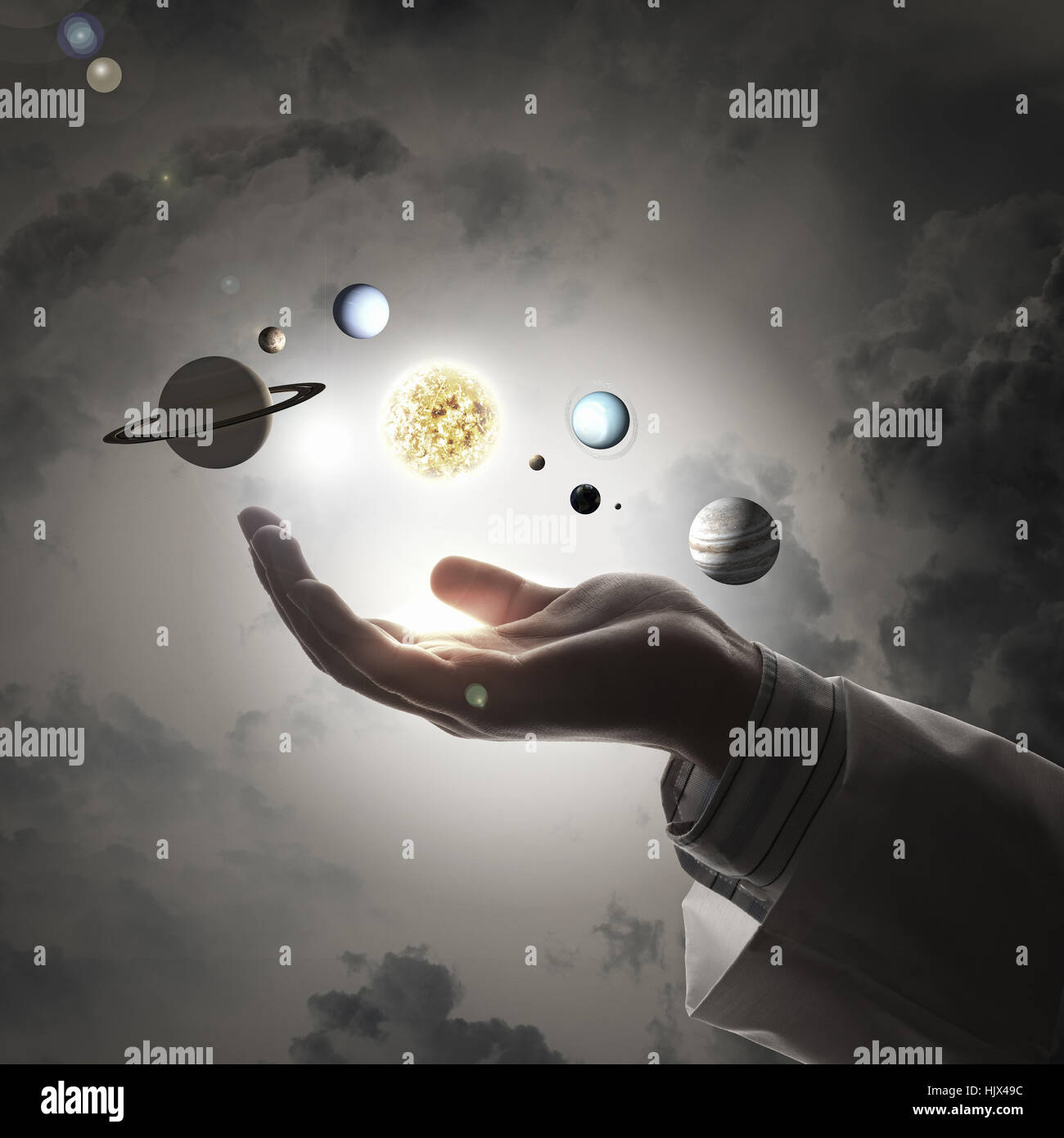 Close up of planet sun system in your hand Stock Photo - Alamy