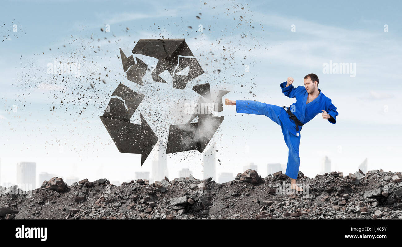 Young determined karate man breaking hi-res stock photography and ...