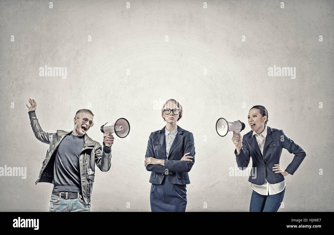 Aggressive people screaming in megaphone on each other Stock Photo - Alamy