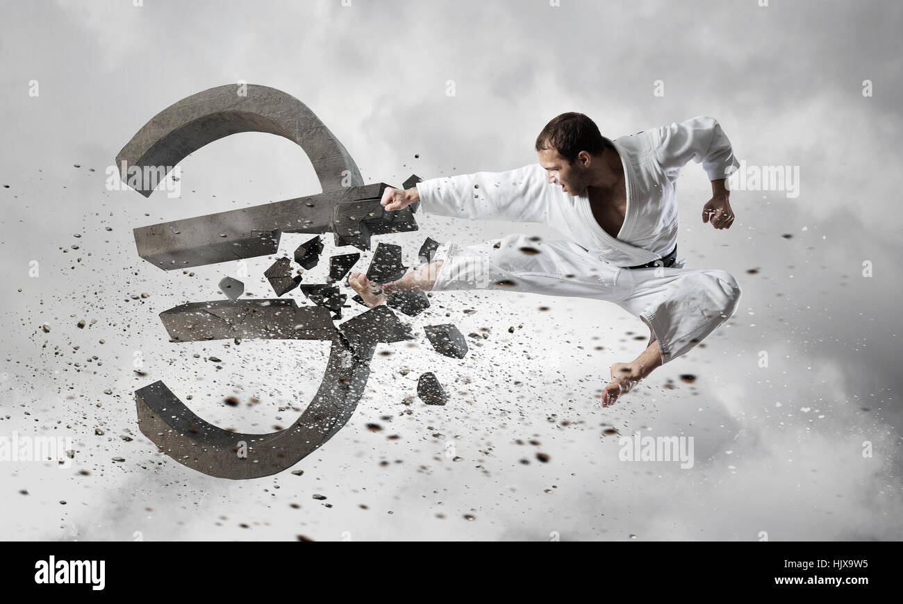 Young determined karate man breaking hi-res stock photography and ...