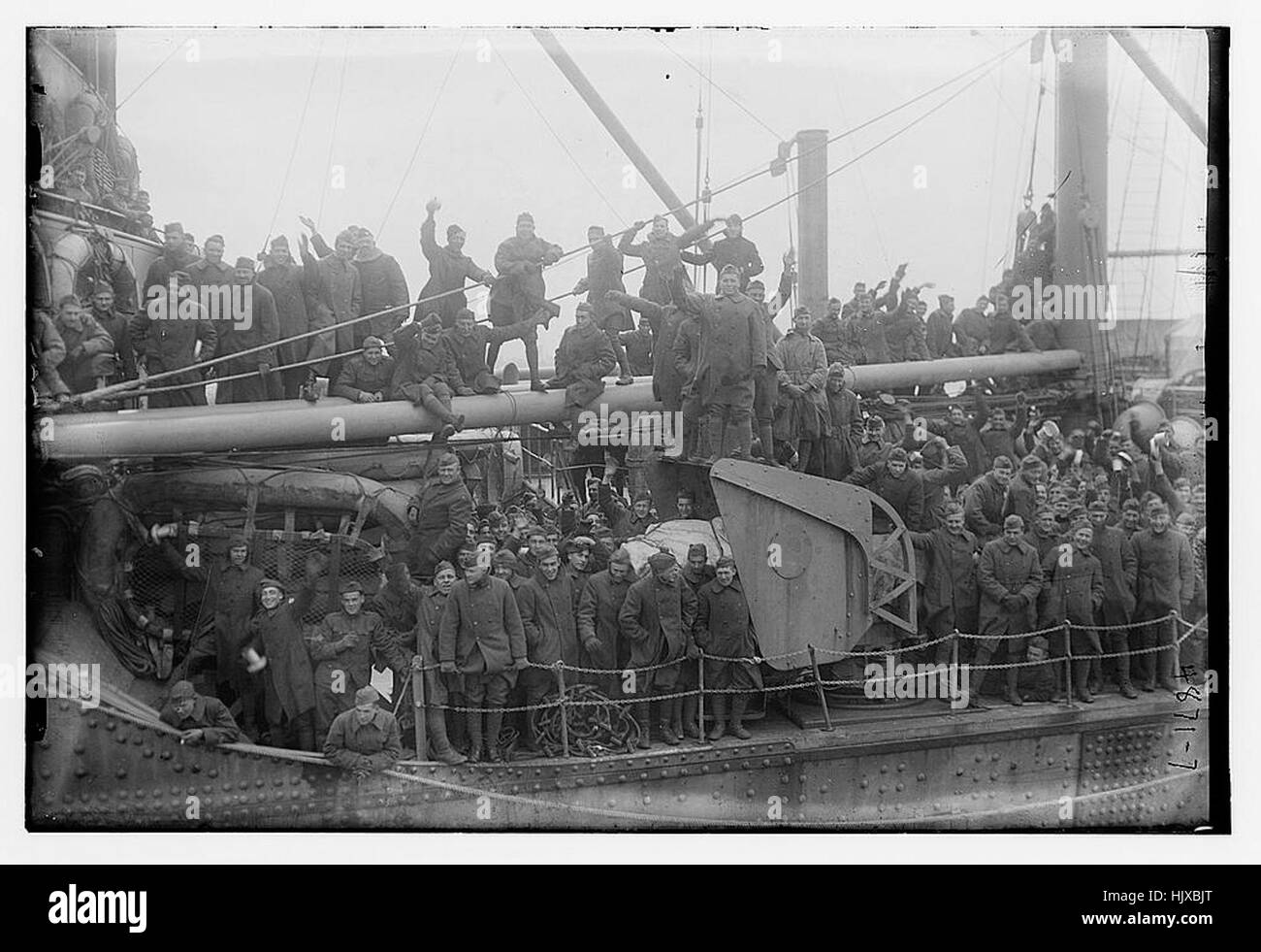 A group portrait of sailors aboard a military ship, reflecting the ...