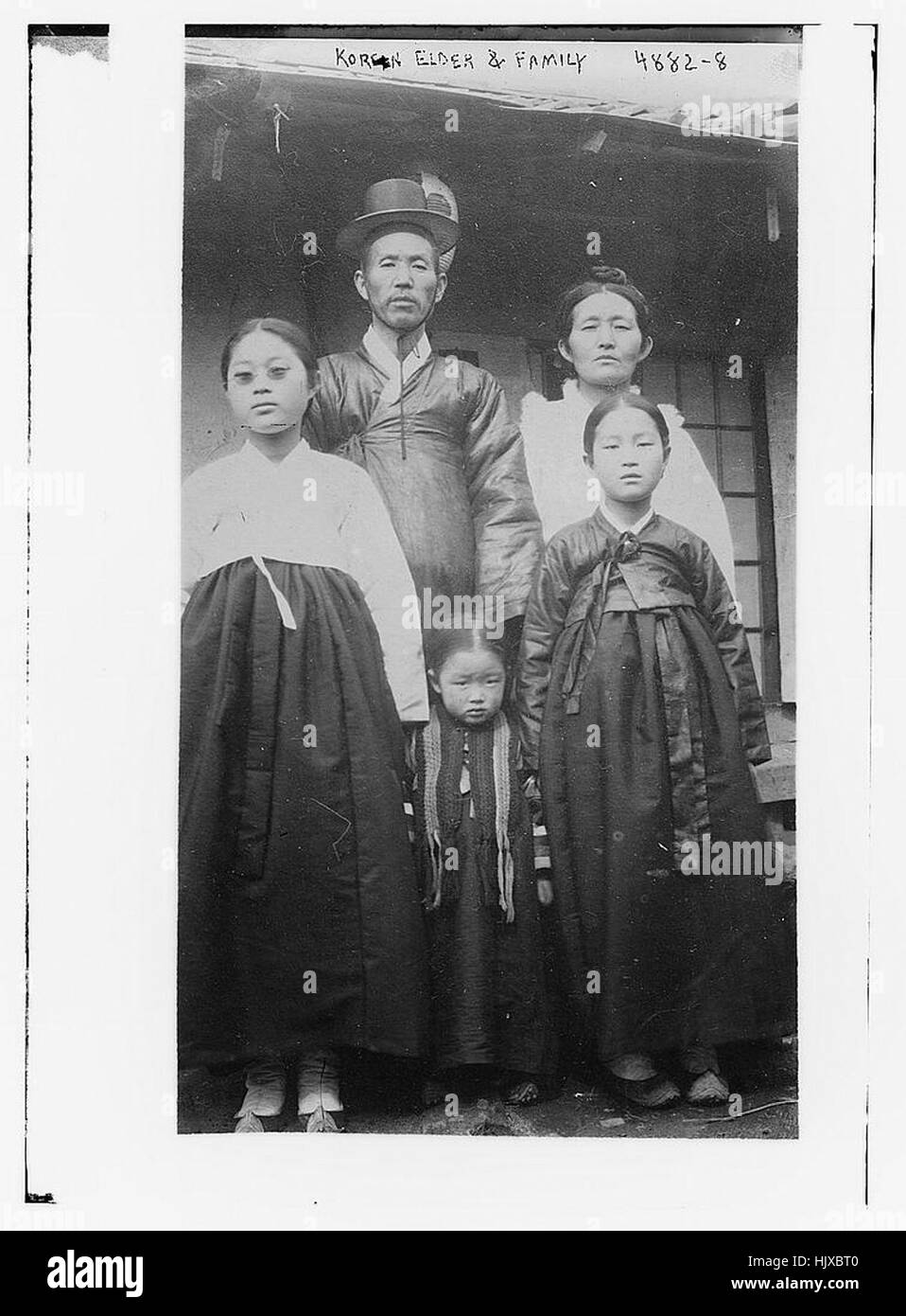 A photograph capturing a Korean elder and family, reflecting the ...